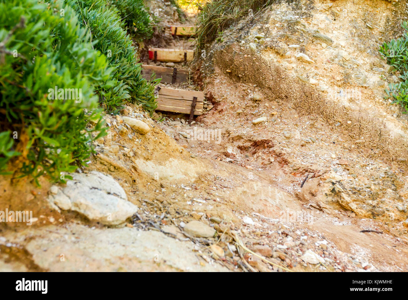 Narrow passage through corridor in rock with carved stairs Stock Photo ...