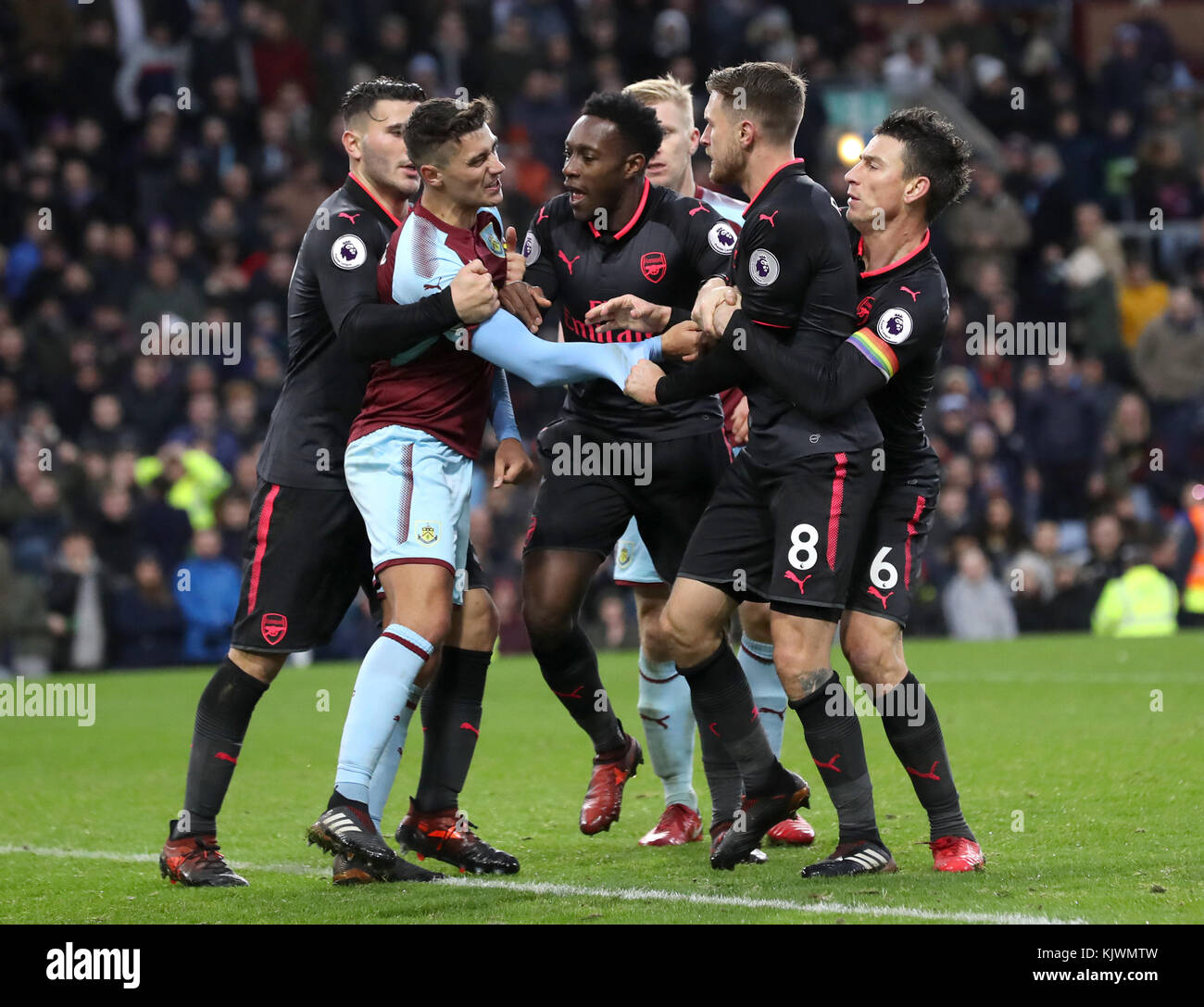 Burnley's Matthew Lowton and Arsenal's Aaron Ramsey have a heated ...