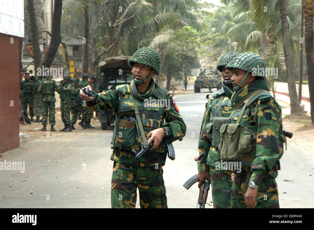 DHAKA, BANGLADESH- FEBRUARY 27, 2009: Army soldiers stand by inside the ...