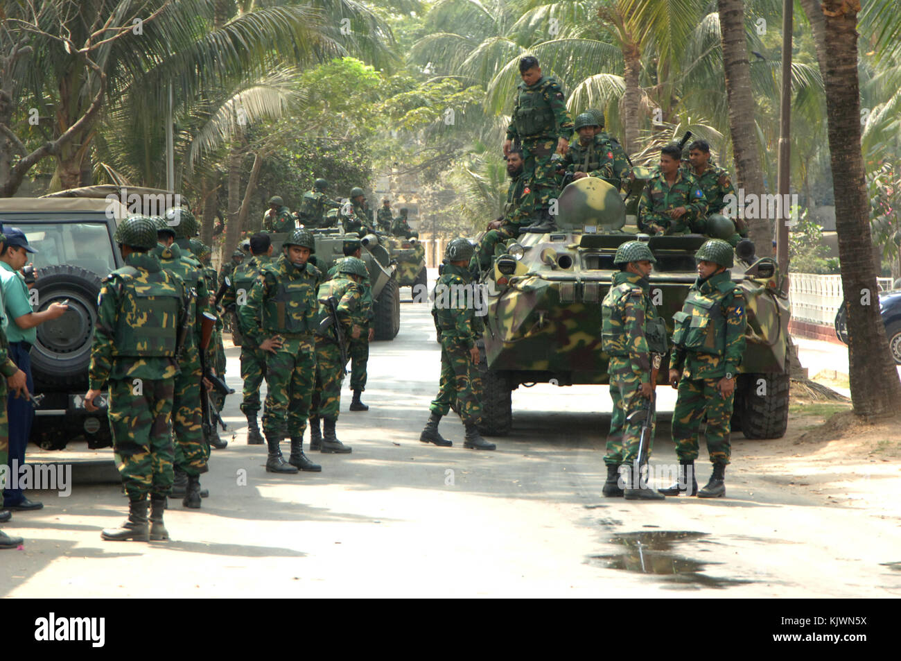 DHAKA, BANGLADESH- FEBRUARY 27, 2009: Army soldiers stand by inside the ...