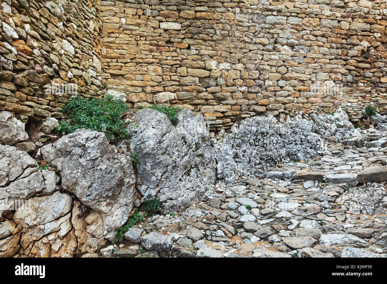 Old slope and wall in the French village of Saint Montan in the Ardeche ...