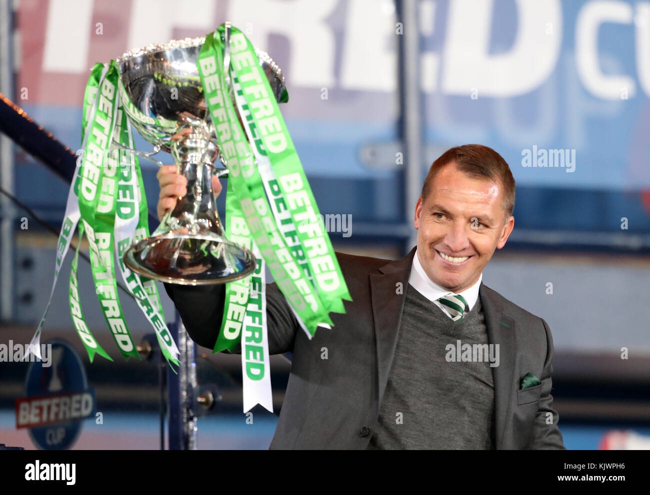 Celtic manager Brendan Rodgers celebrates with the trophy after winning ...
