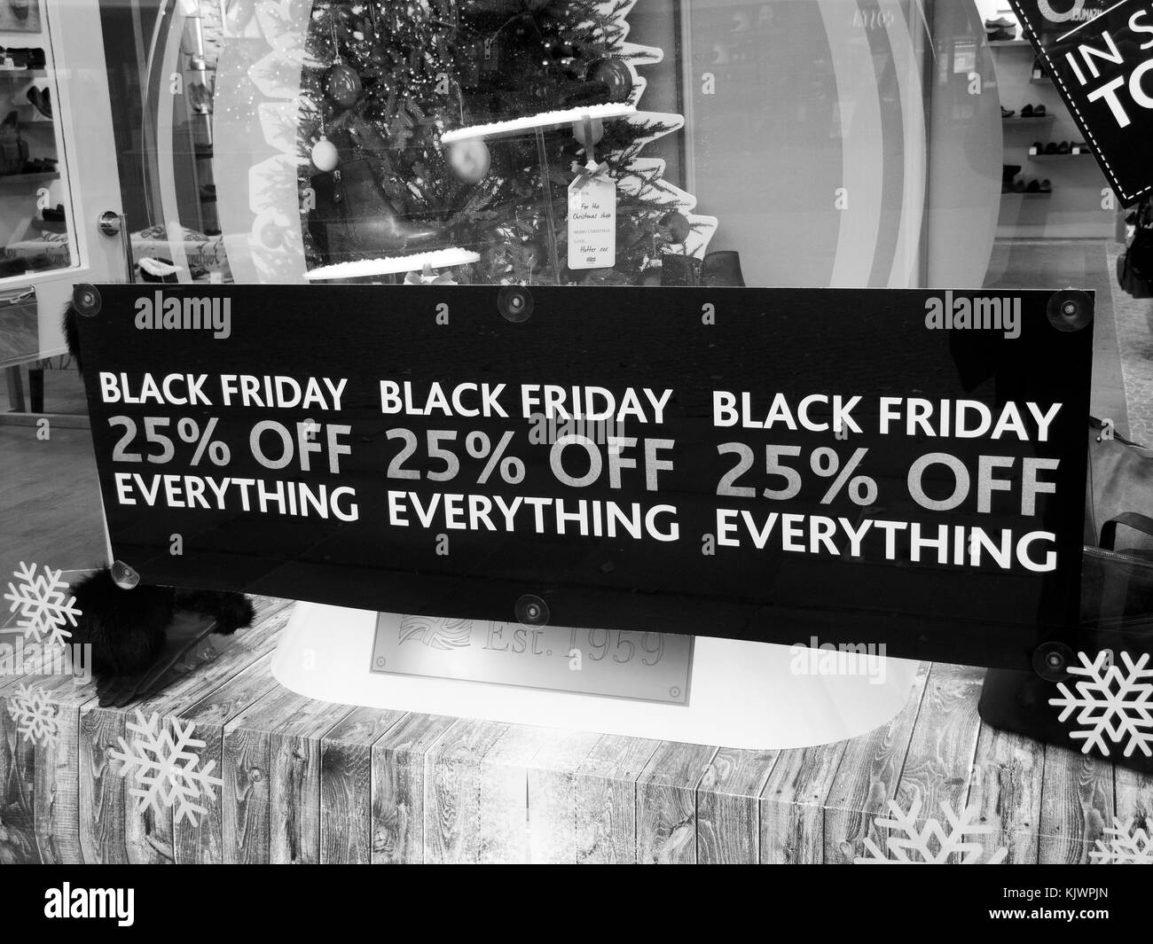 Black Friday signs in high street stores advertising price discounts ...