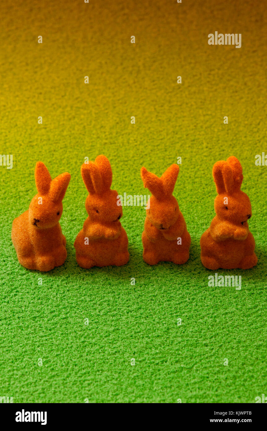 four miniature figurines of Easter bunnies Stock Photo - Alamy