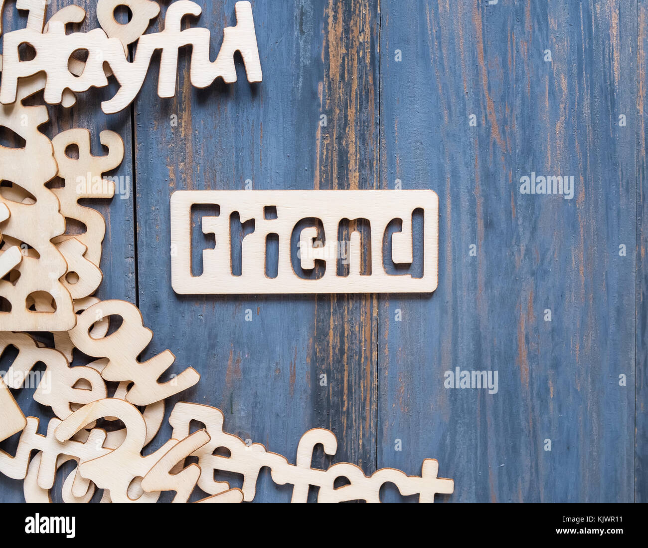Word made of wooden letters and Pile of wooden block letters on blue ...