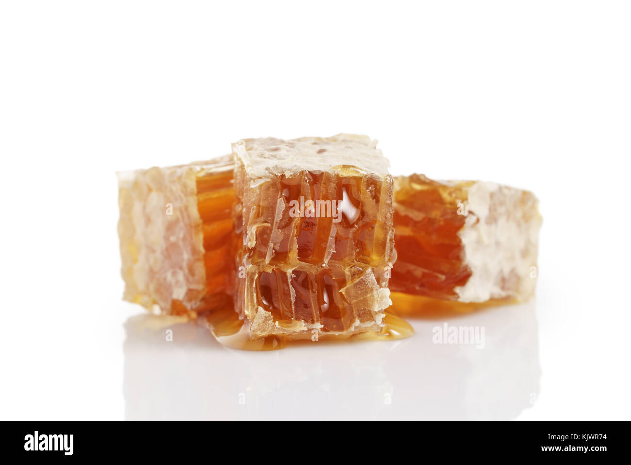 three pieces of honeycom isolated on white Stock Photo - Alamy