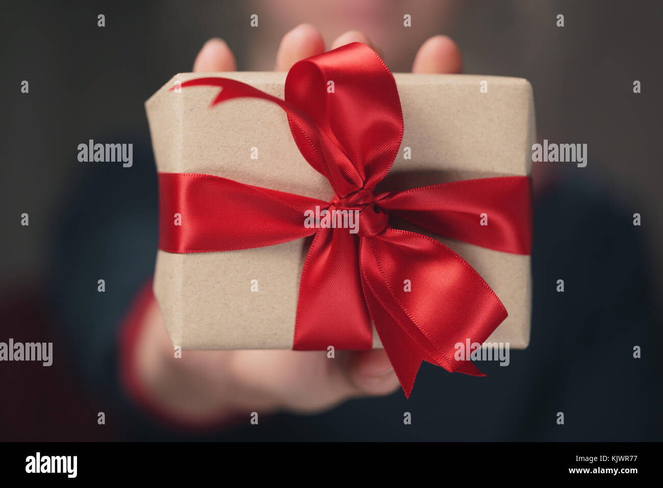 Brown gift box red ribbon hi-res stock photography and images - Alamy