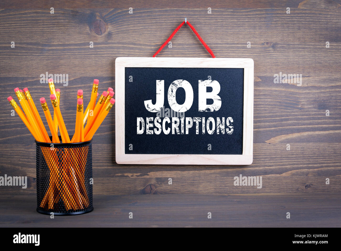 Job Descriptions. Career and success concept. Chalkboard on a wooden ...