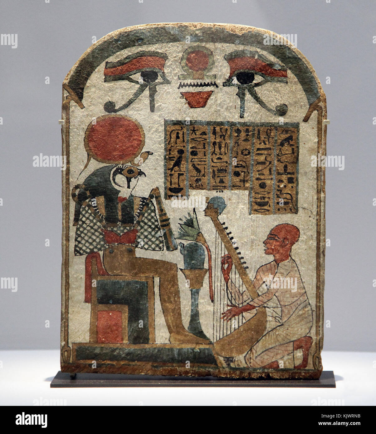 Painted wooden Stela;the singer Djedkhonsouioufankh playing the harp ...