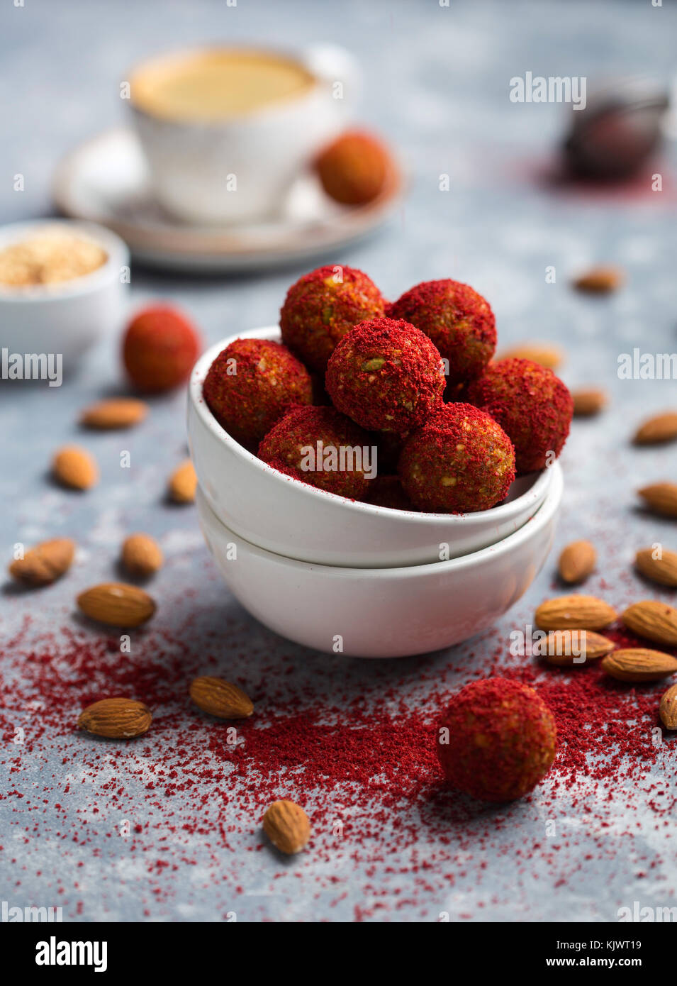 Healthy raw almond sweets in a small white bowl Stock Photo - Alamy