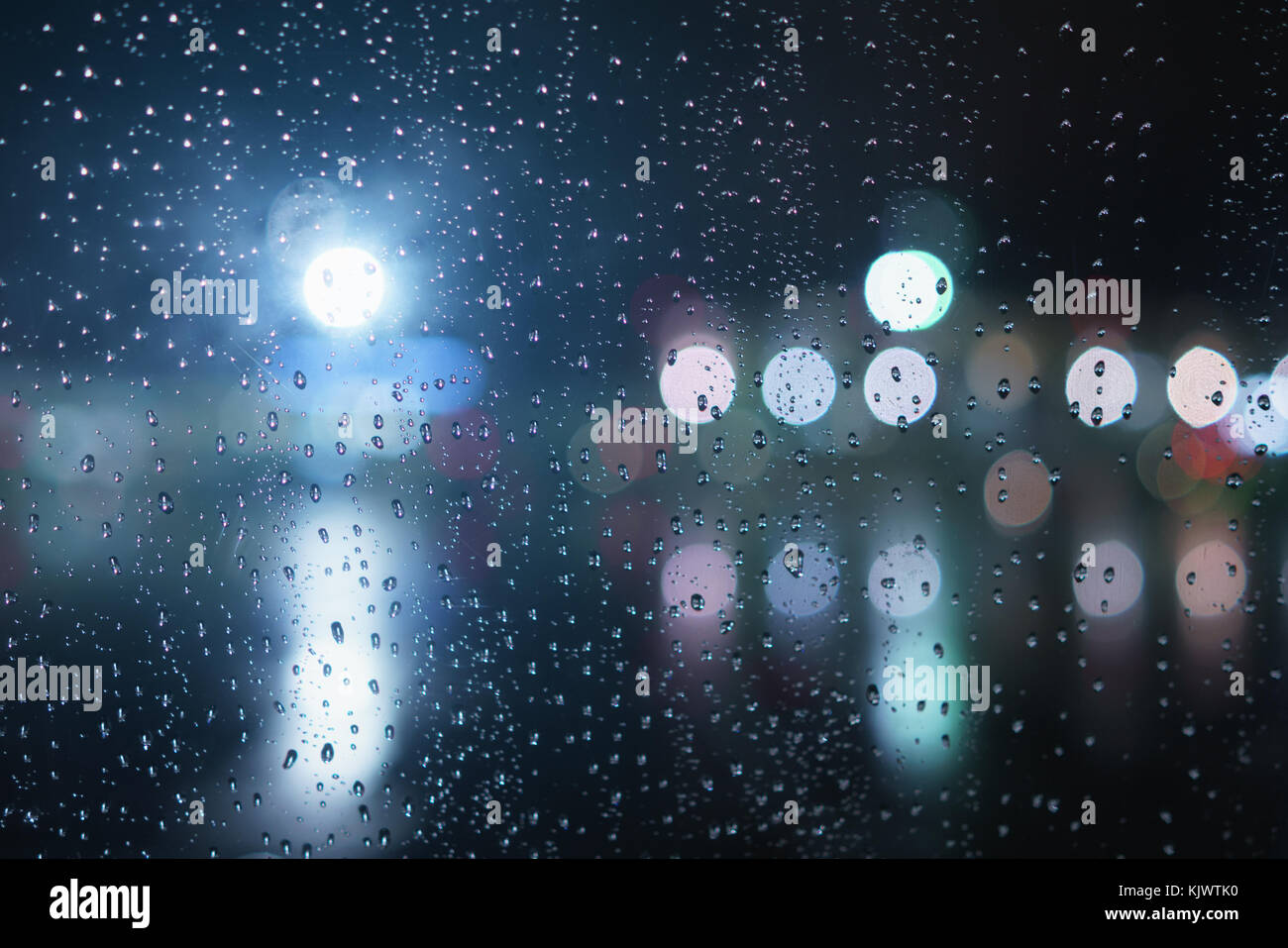 closeup of raindrops on window in night with lights Stock Photo - Alamy