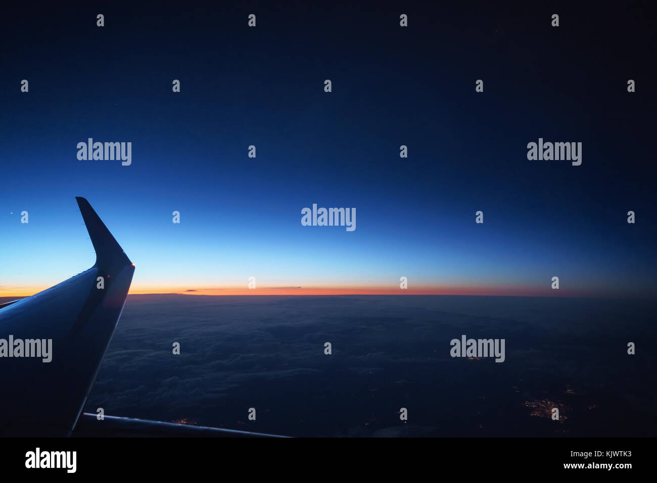 aerial view of plane wing in sunrise during flight Stock Photo - Alamy