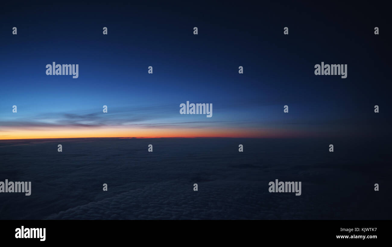 clouds in early morning during flight on a plane Stock Photo - Alamy
