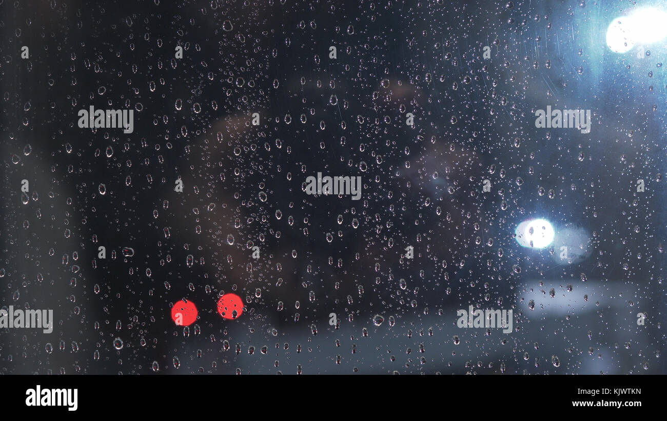 closeup of raindrops on window in night with lights Stock Photo - Alamy