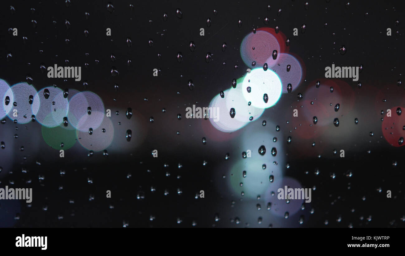 closeup of raindrops on window in night with lights Stock Photo - Alamy
