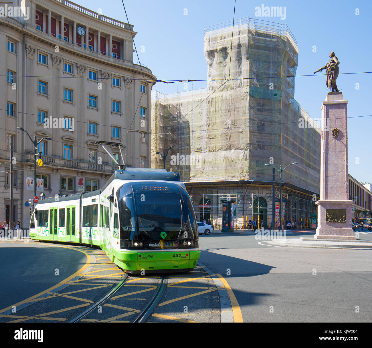 Electric tram transport system passing the statue of Diego Lopez de ...