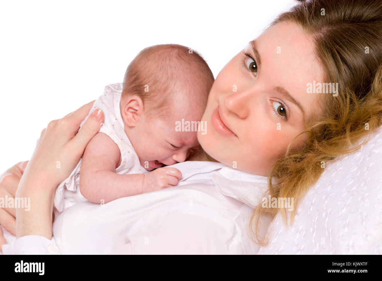 Happy mother holding her crying baby isolated Stock Photo - Alamy