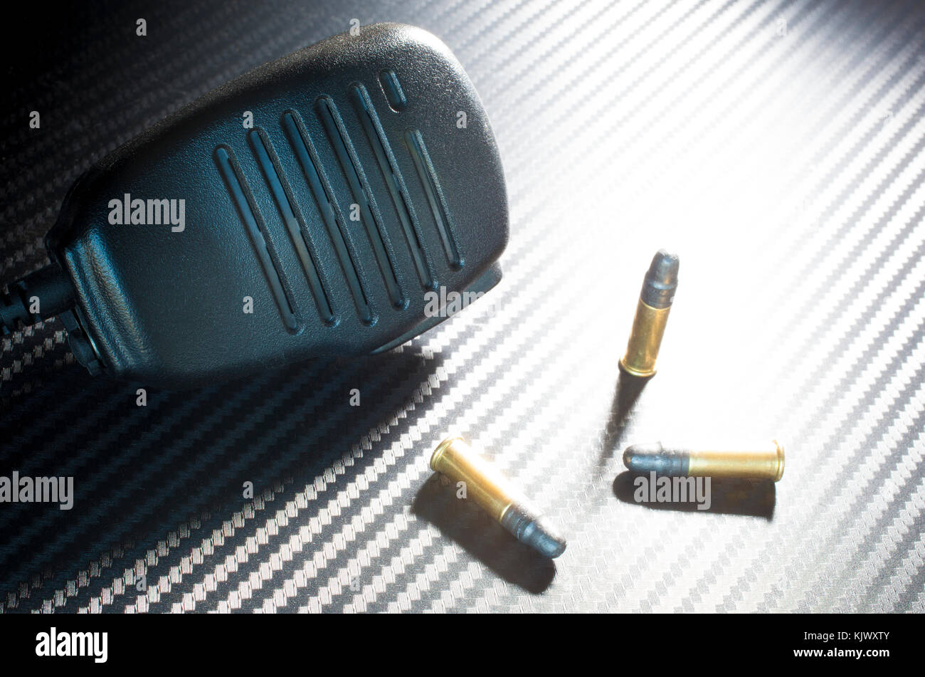 Rim fire cartridges with a police style radio microphone Stock Photo ...