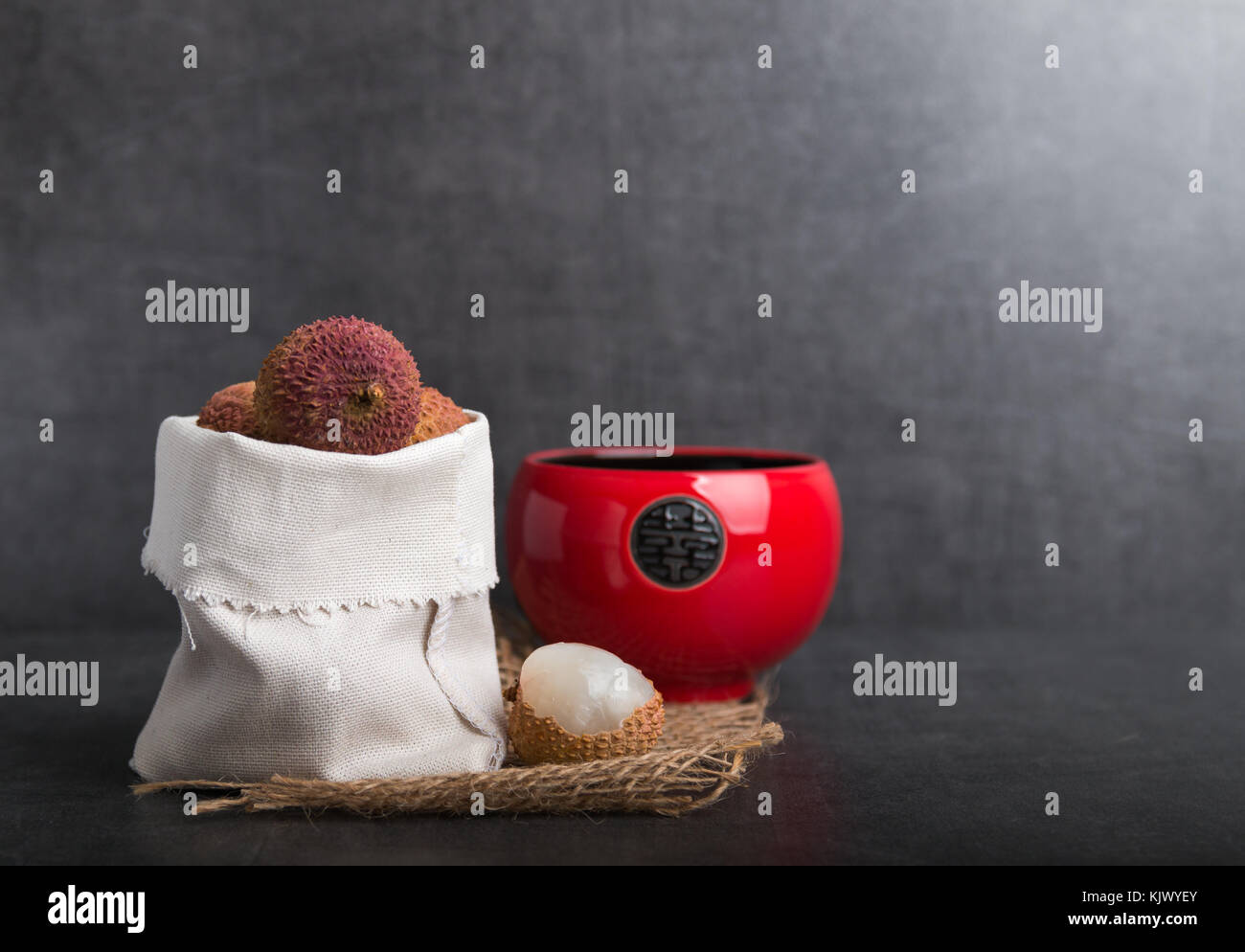 lychee fruit on a grey stone background Stock Photo - Alamy