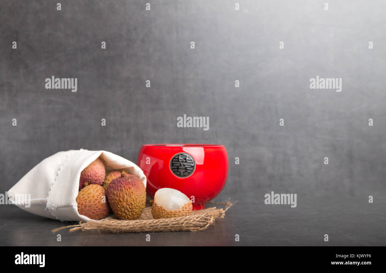 lychee fruit on a grey stone background Stock Photo - Alamy