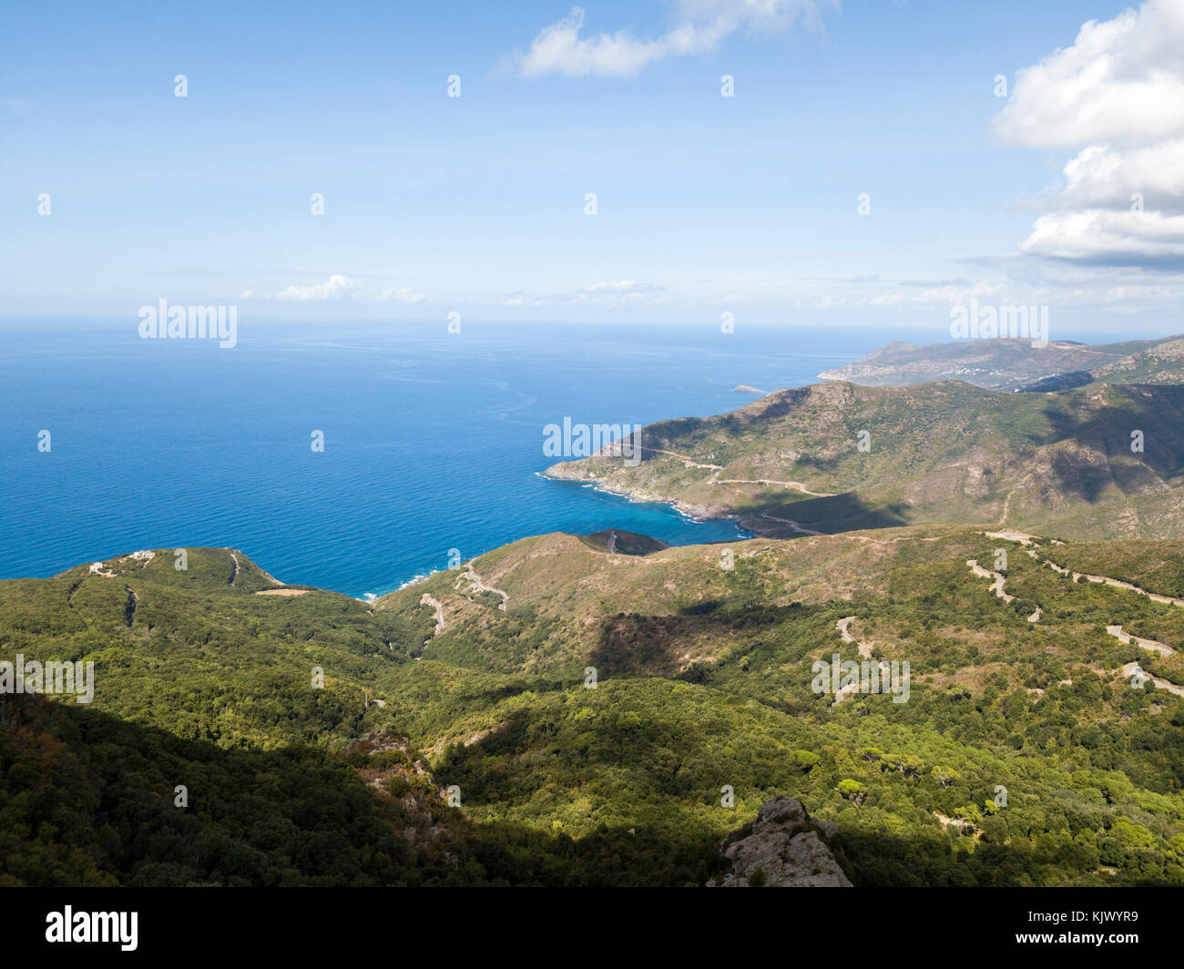 Aerial view of winding roads of the French coast. Cap Corse Peninsula ...