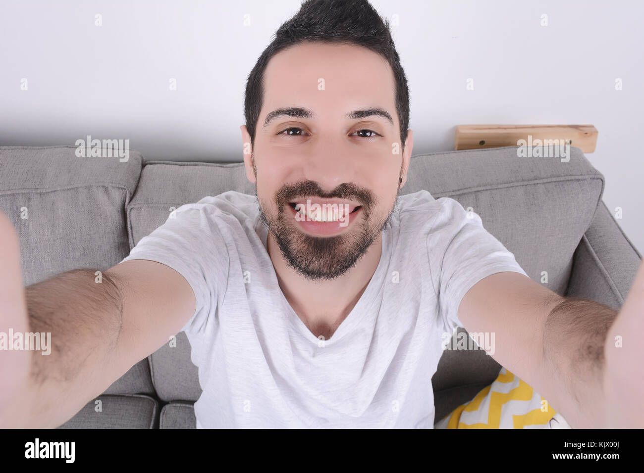 Attractive young man taking selfie. Indoors Stock Photo - Alamy