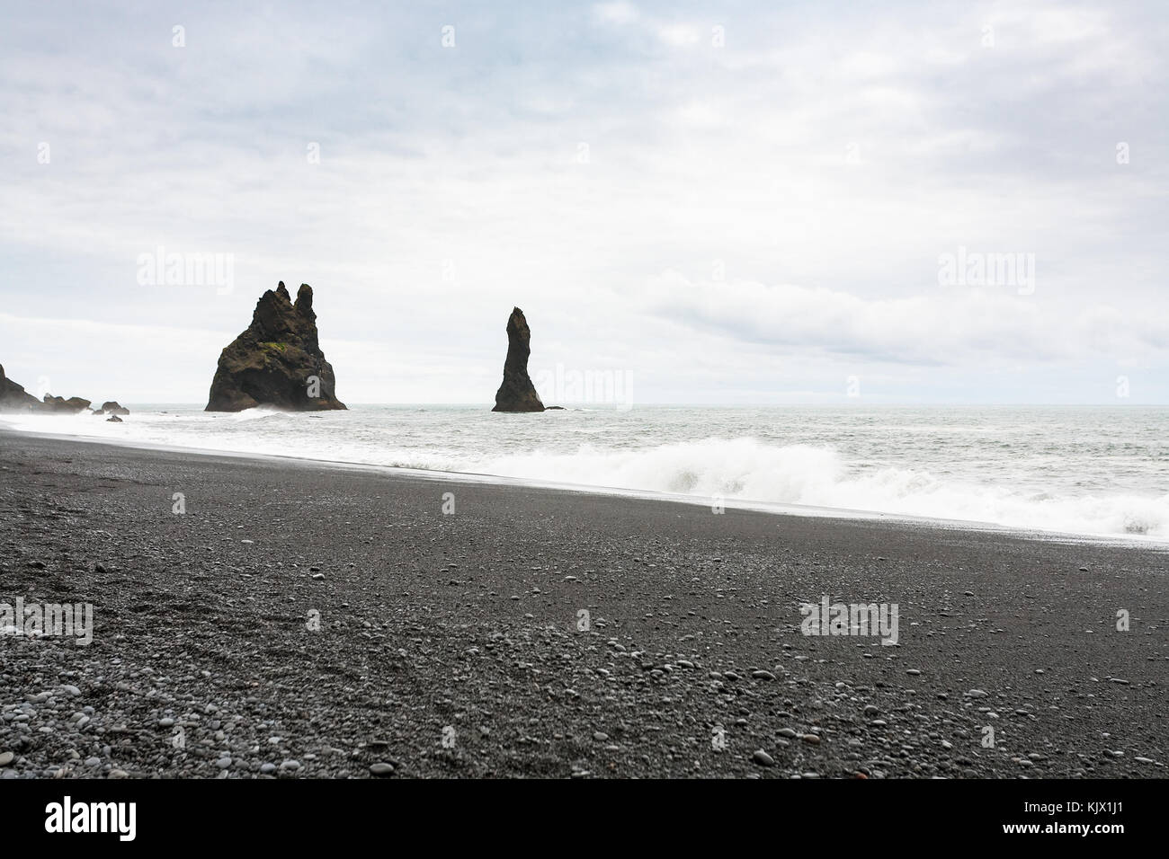 travel to Iceland - view of Reynisdrangar basalt stacks on Reynisfjara ...