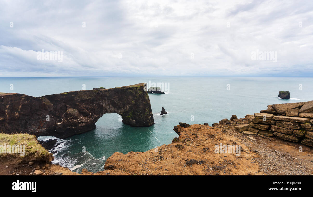 travel to Iceland - view of stone arch on Dyrholaey cliff near Vik I ...