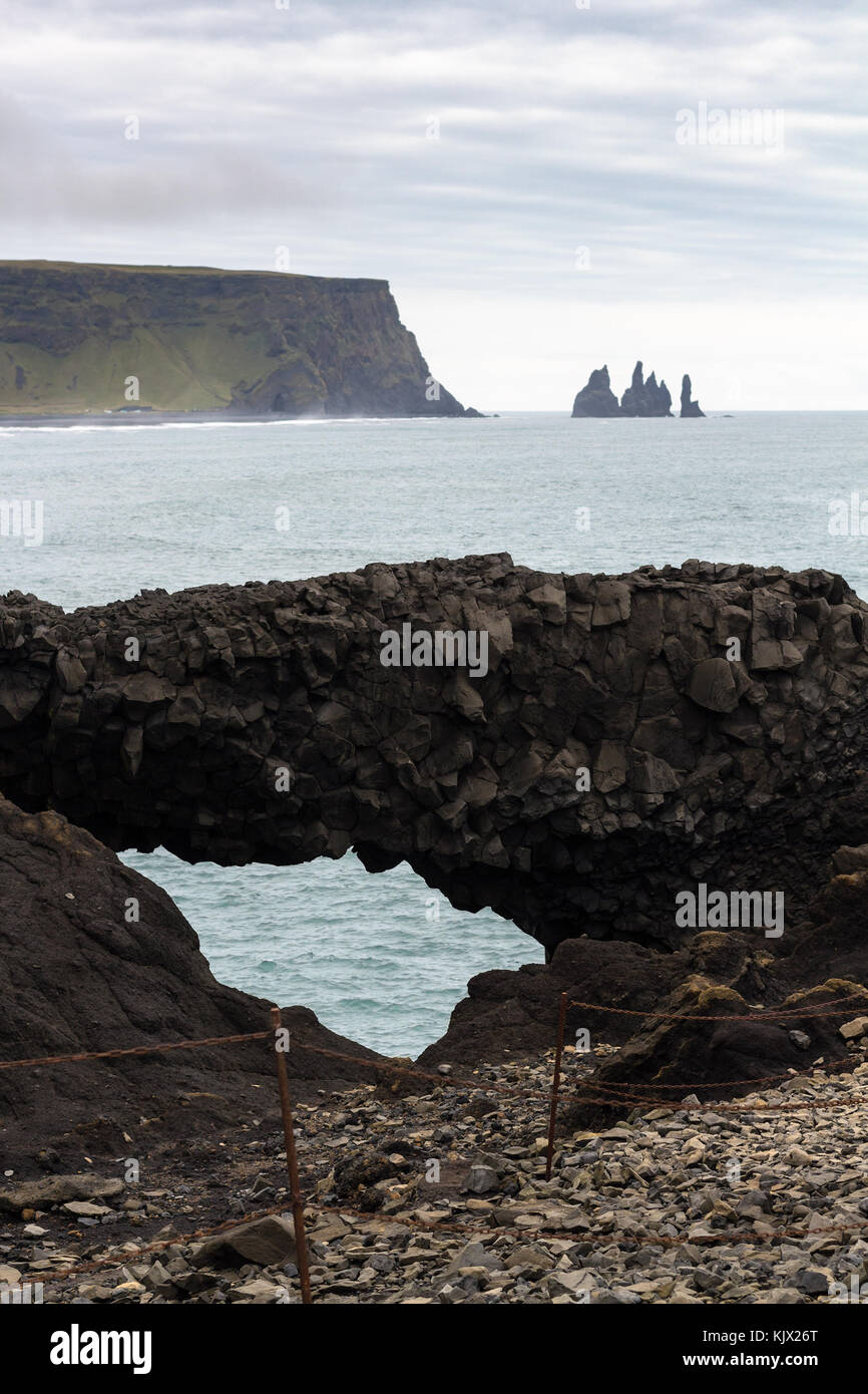 travel to Iceland - volcanic stone arch on Kirkjufjara beach near Vik I ...