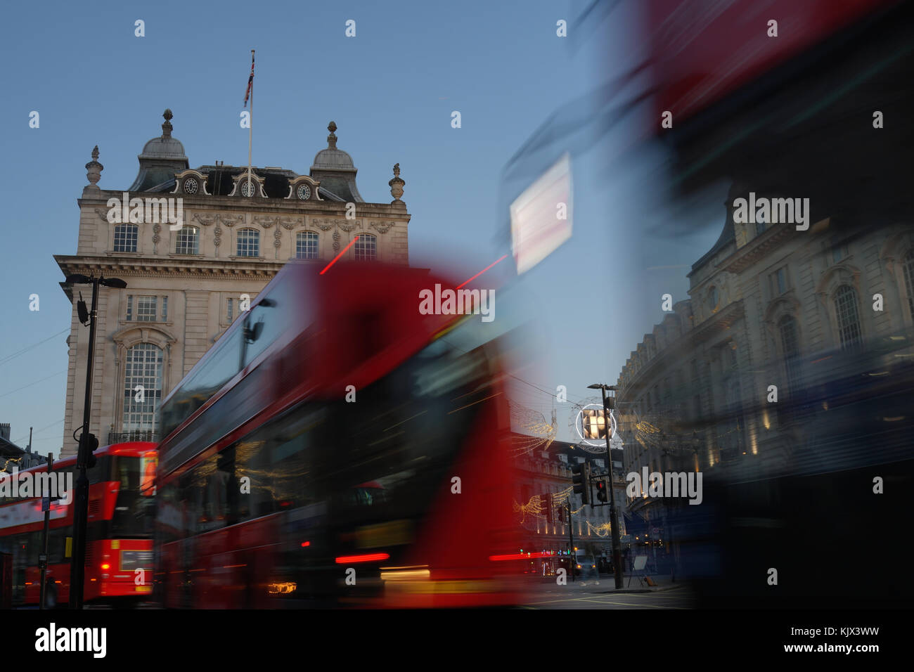 London buses drive through Piccadilly Circus, London Stock Photo - Alamy