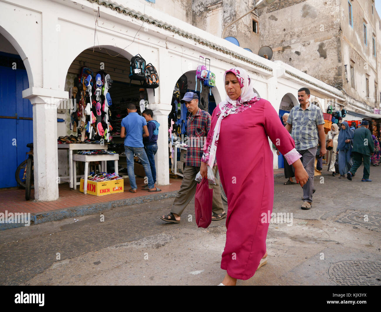 Woman walking on a street hi-res stock photography and images - Alamy