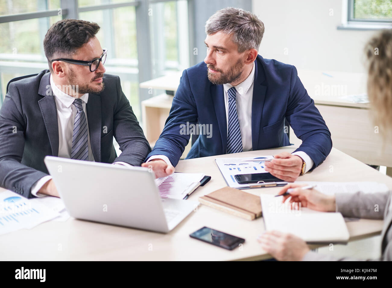 Productive discussion of joint project: group of colleagues gathered ...