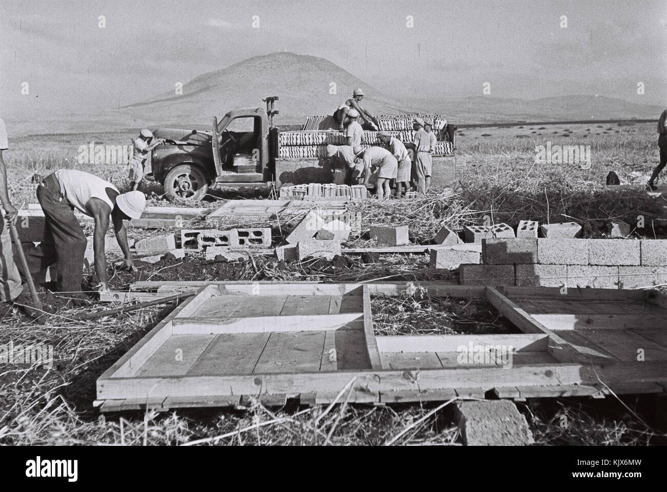 WORLD WAR 2 VETERANS PUTTING UP THE FIRST HUT ON THE DAY OF THE ...
