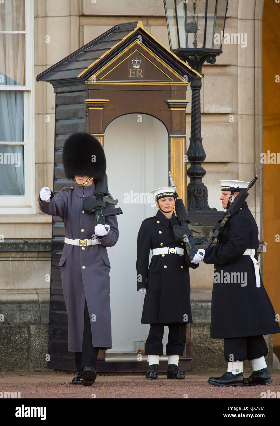 Able seaman Alex Stacey (centre) takes her position in a sentry box, as ...