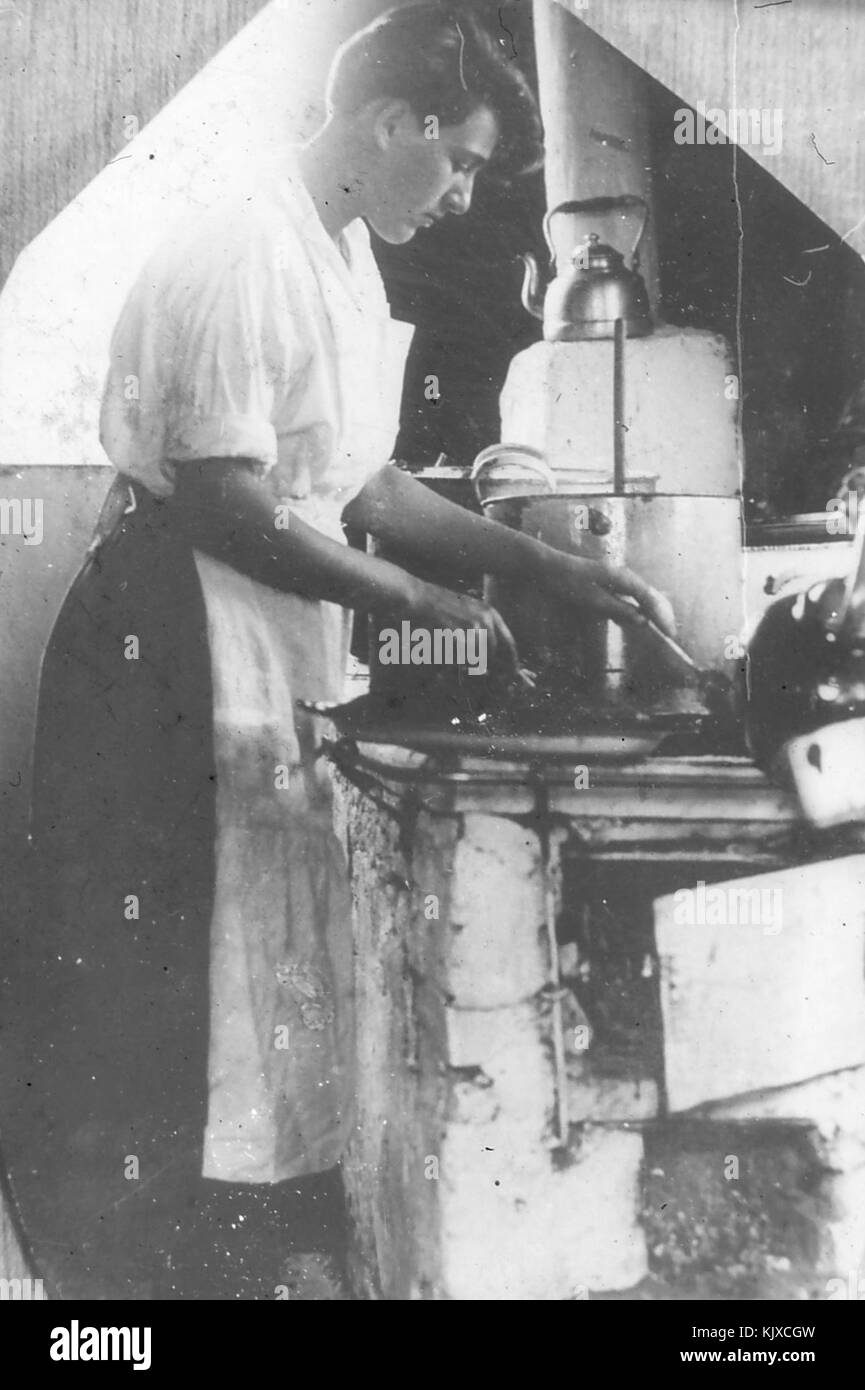 This 1933 photograph captures a moment in the kitchen at Gan Shmuel ...