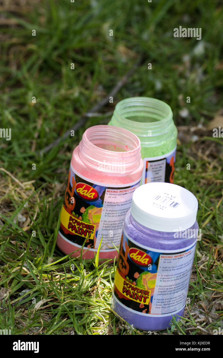 Young funky couple playing with colourful water paint powder on the ...