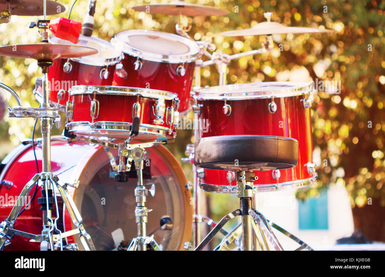 Set of drums outdoor with sunlight blurred background Stock Photo - Alamy