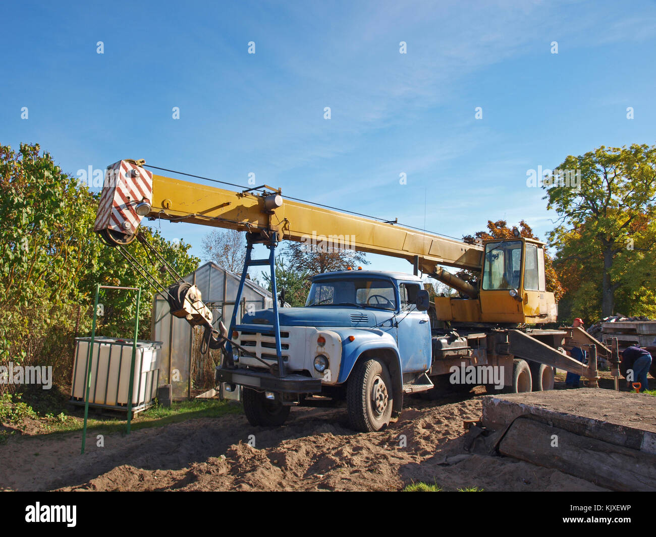 Vintage russian mobile crane in country farm yard Stock Photo - Alamy