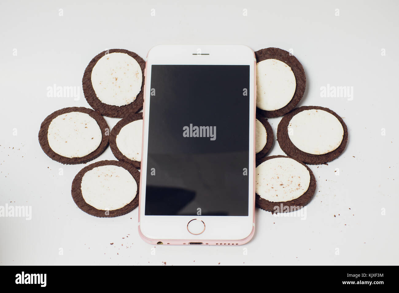 Modern mobile smartphone chocolate cookies stacked served milk the ...