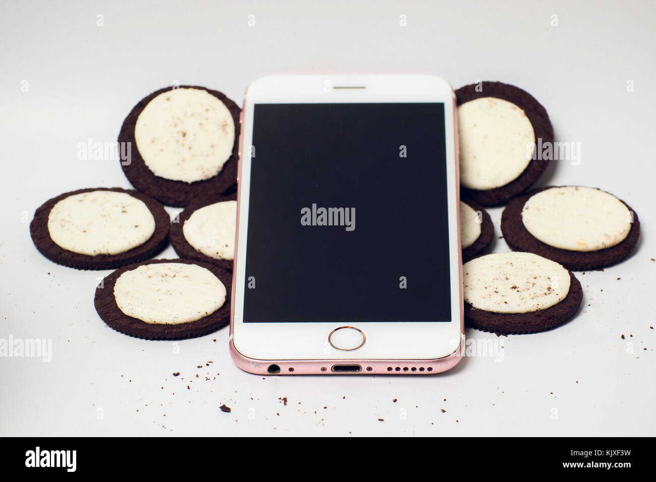Modern mobile smartphone chocolate cookies stacked served milk the ...