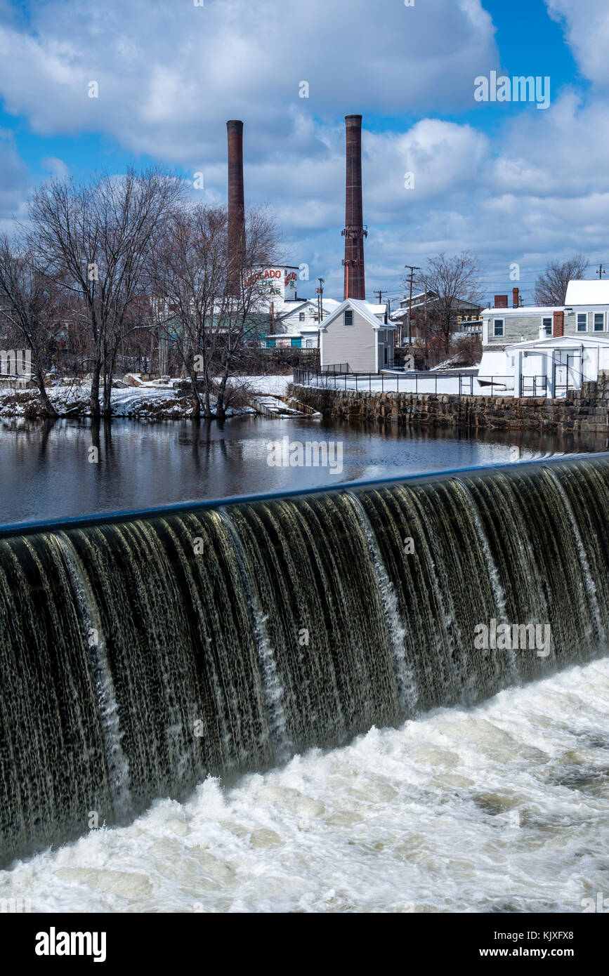 Waterfalls from the Great Stone Dam with smoke stacks in the background ...
