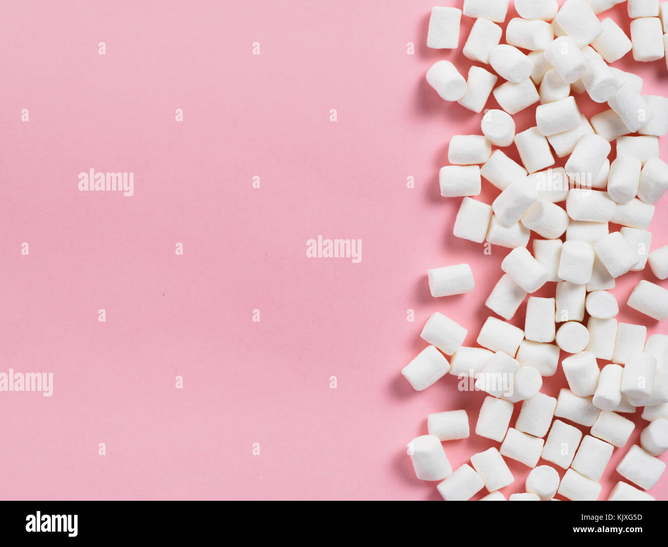 Marshmallows on pink background with copyspace. Flat lay or top view ...