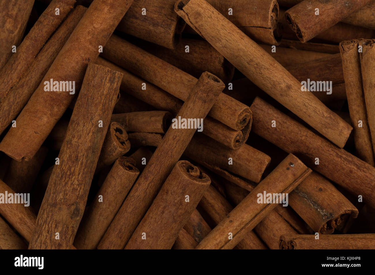 Cinnamon sticks spice closeup background. Texture of cinnamon sticks ...