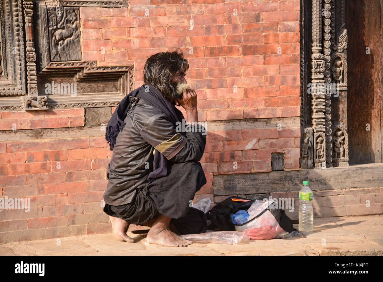 Homeless man in the UNESCO temples of Bhaktapur, Nepal Stock Photo - Alamy