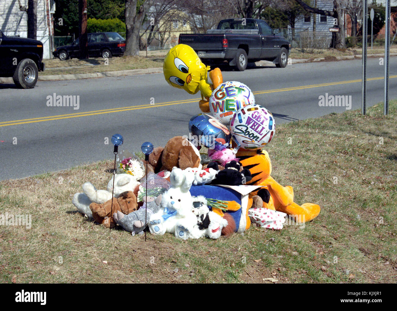 Makeshift memorial set up by neighborhood residents for a small child ...