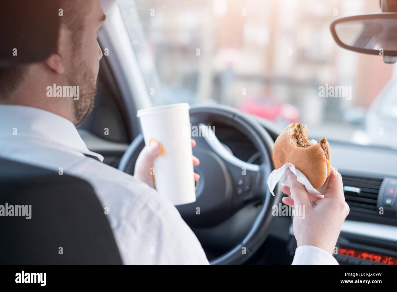 Man eating burger hurry hi-res stock photography and images - Alamy