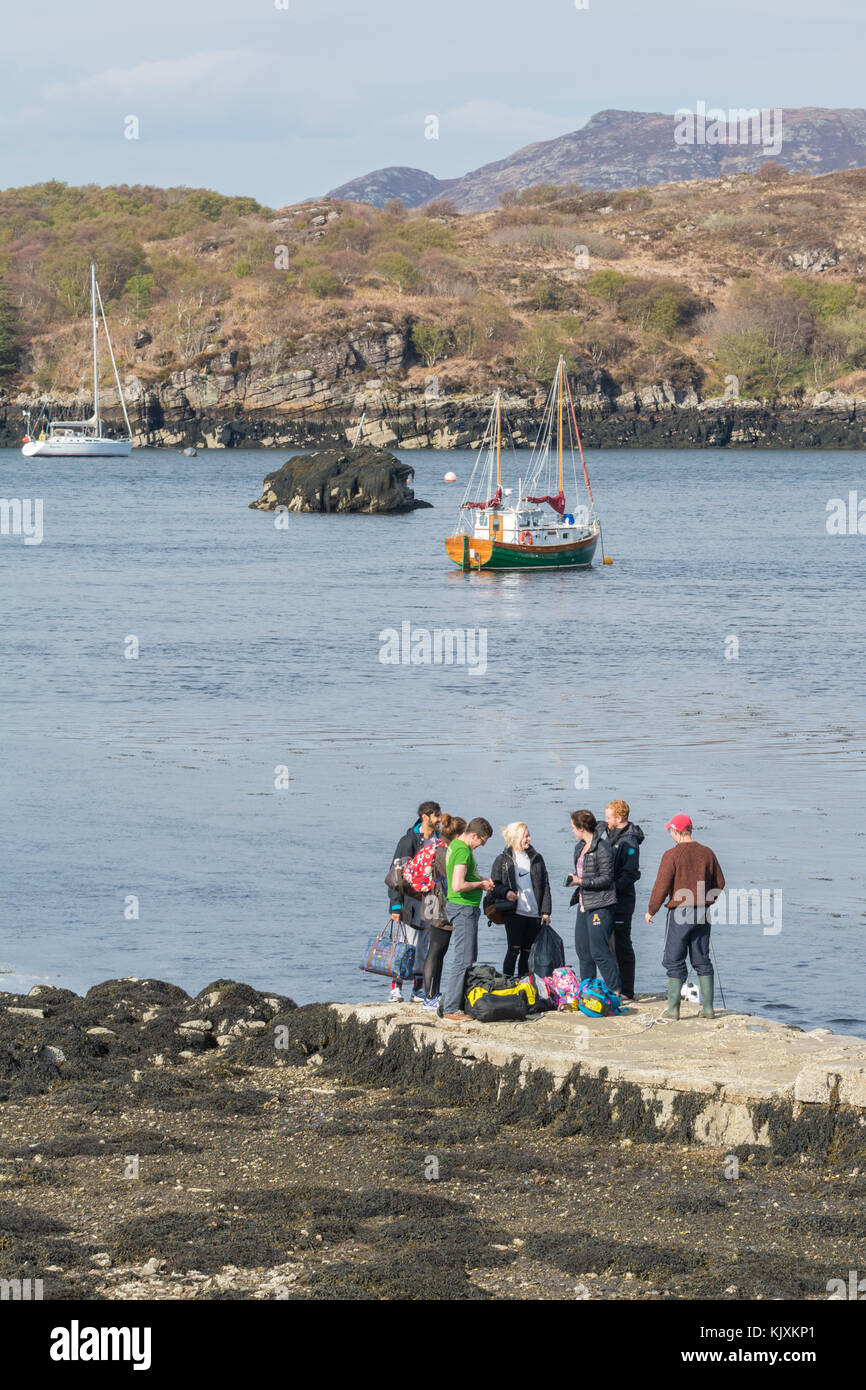 young people standing on Badachro Jetty on Loch Gairloch close by ...