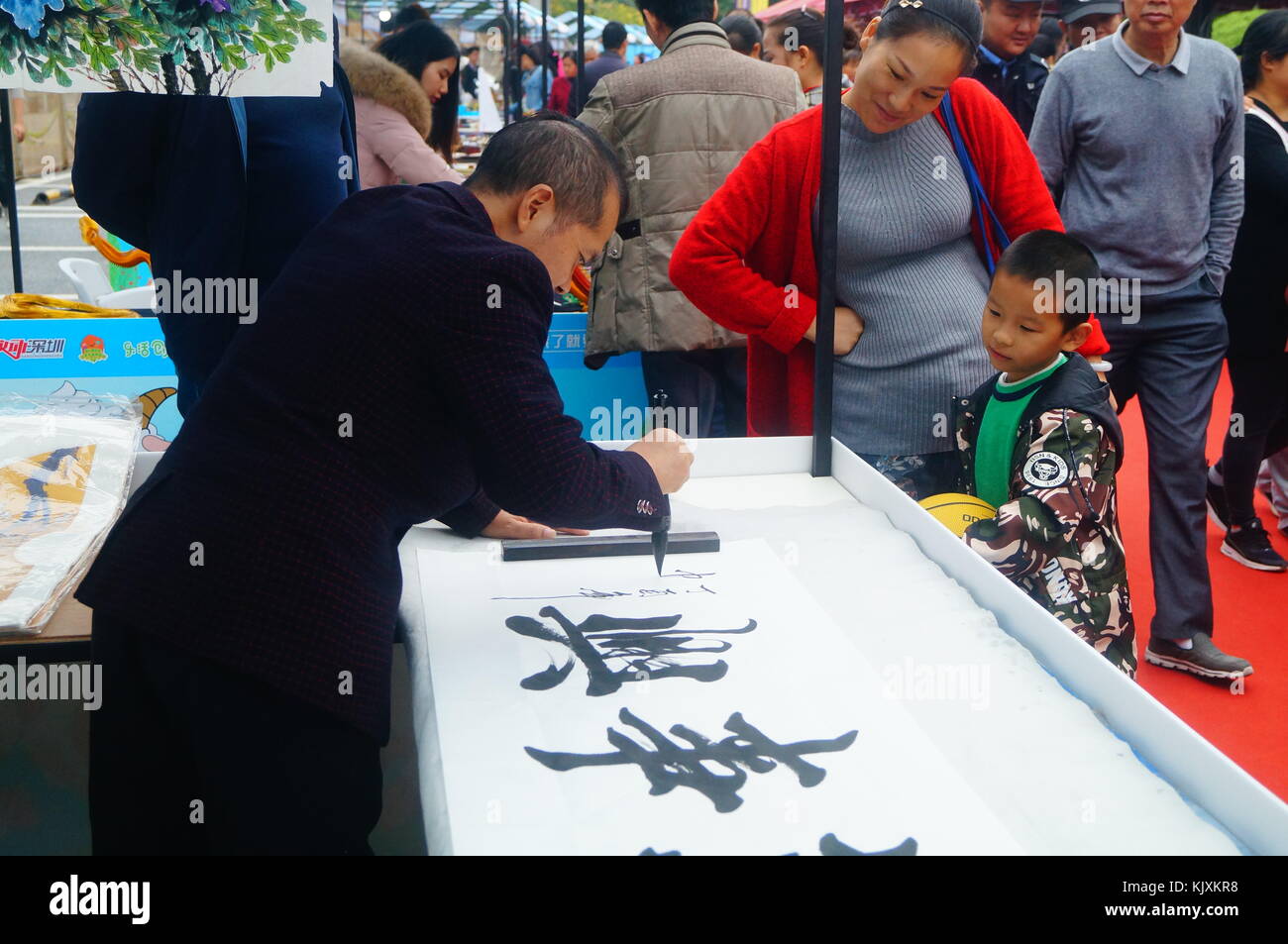 A Chinese calligraphy artist is selling his own calligraphy paintings ...
