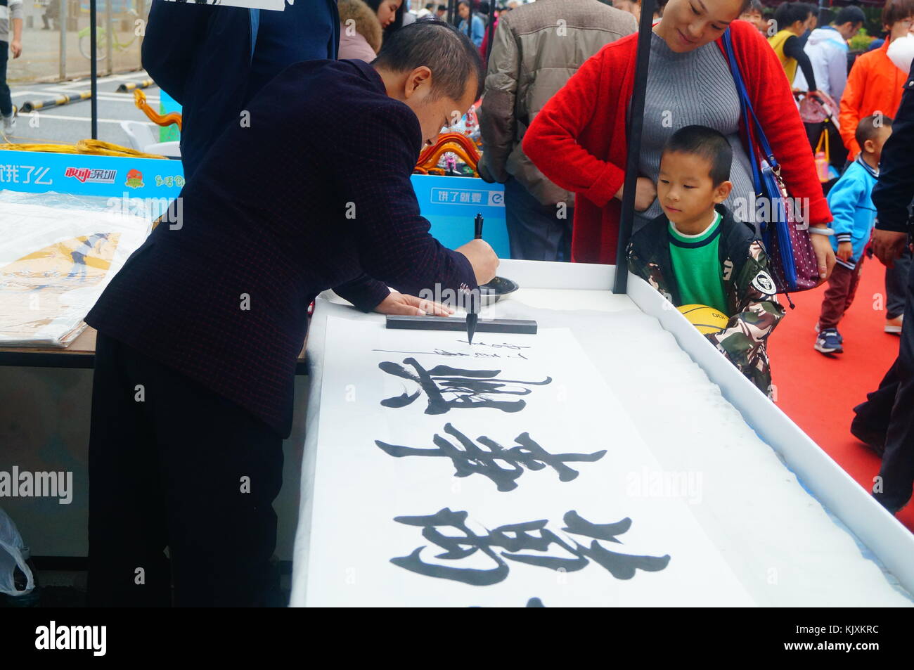 A Chinese calligraphy artist is selling his own calligraphy paintings ...