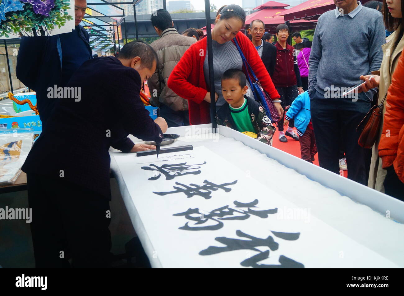 A Chinese calligraphy artist is selling his own calligraphy paintings ...